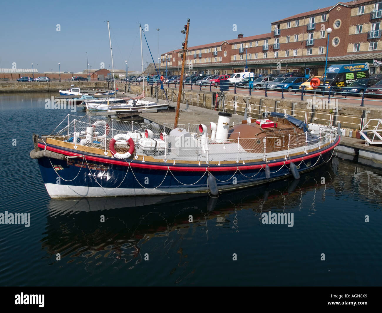 A retired lifeboat now a pleasure craft moored in front of restaurants ...