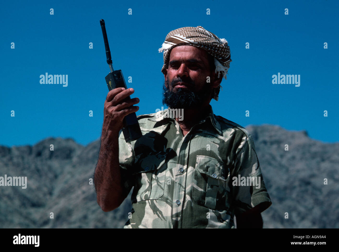 Game guard with radio transmitter Sultanate of Oman Stock Photo - Alamy