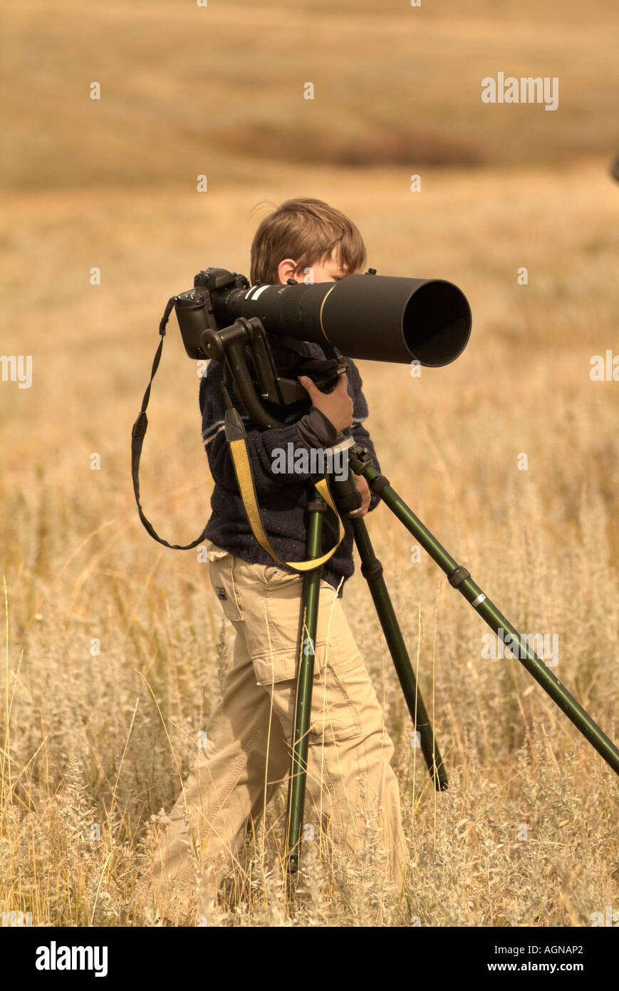 Boy with a very large camera Stock Photo - Alamy