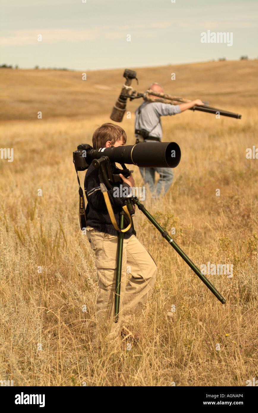 Boy with a very large camera Stock Photo - Alamy