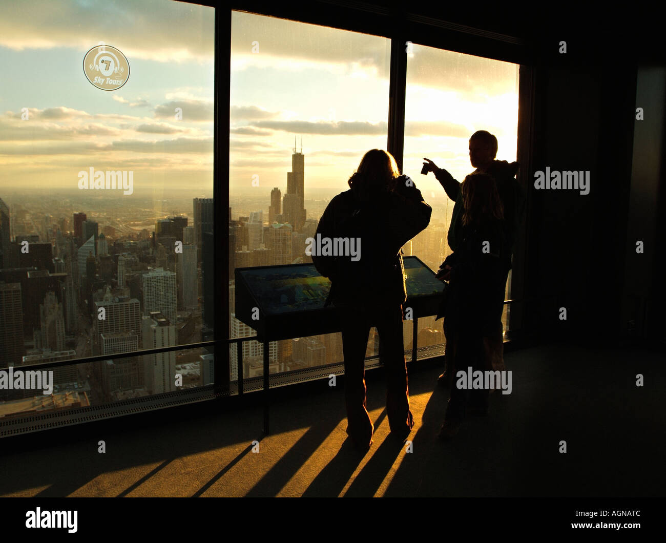 Tourists admire the view of the Chicago Skyline and the Sears Tower at ...