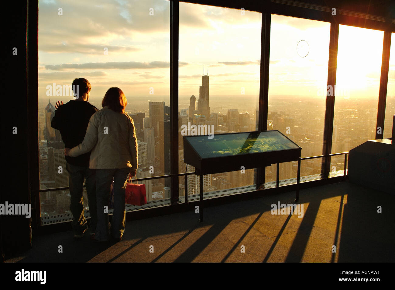 Tourists admire the view of the Chicago Skyline and the Sears Tower at ...