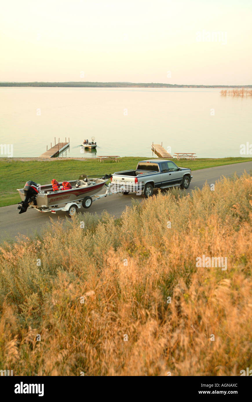 Truck pulling a fishing boat along Devils Lake North Dakota Stock Photo ...