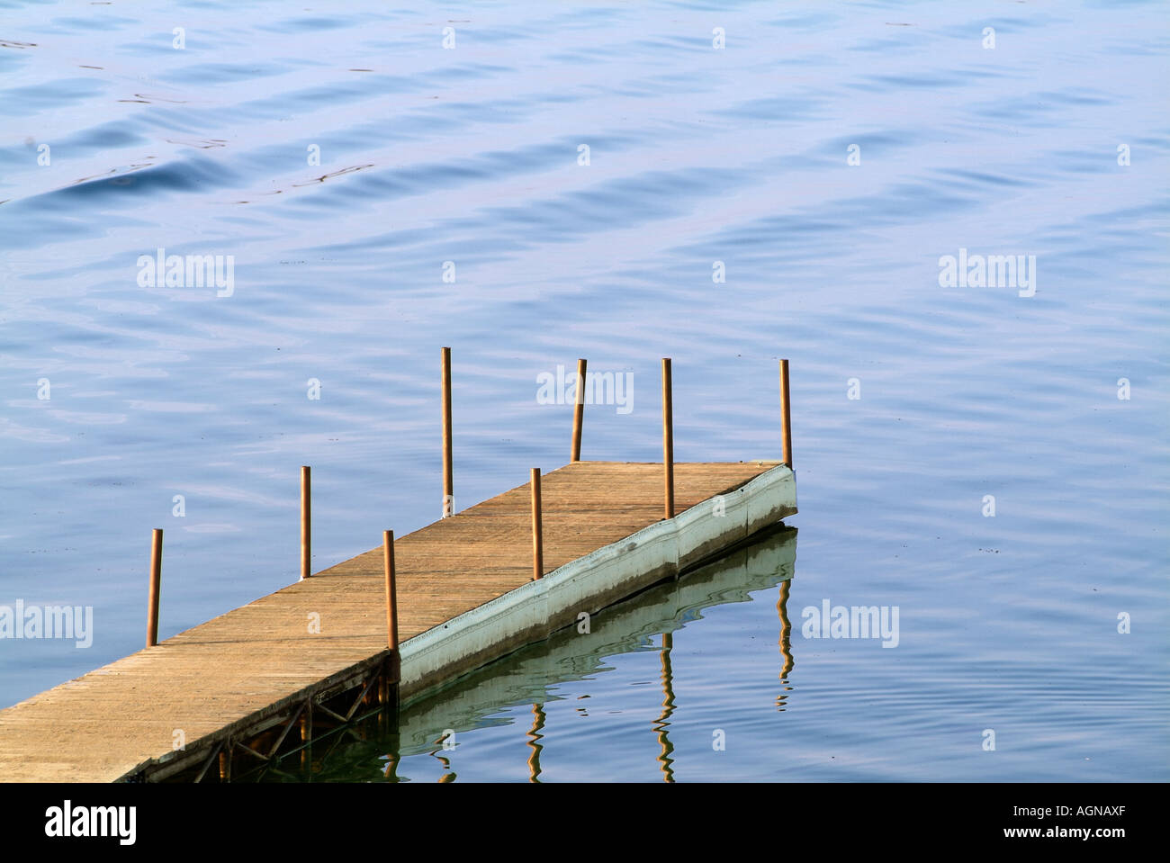 Fishing dock in a lake Stock Photo - Alamy