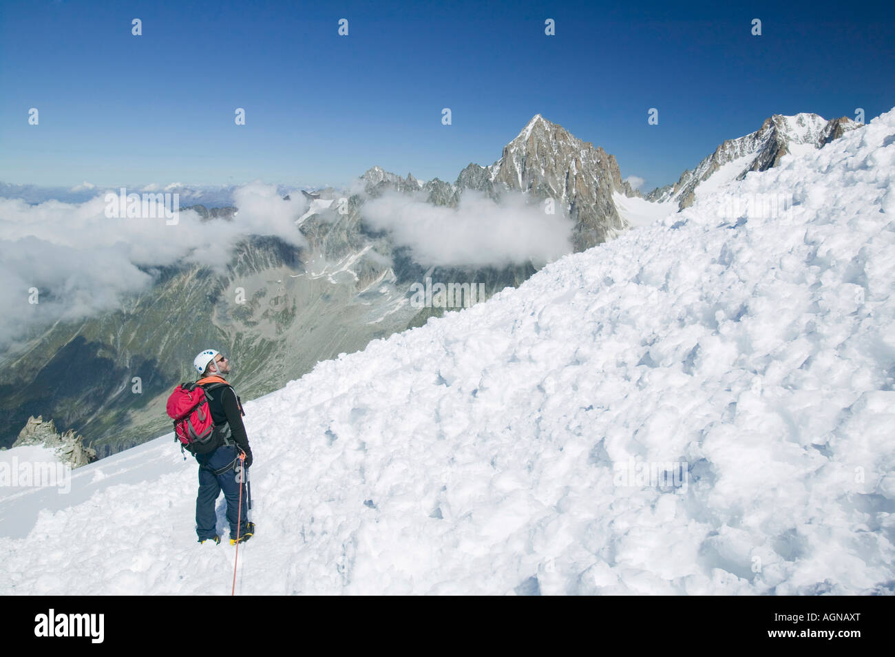 A climber crosses avalanche debris on the Grand Montets Chamonix France ...