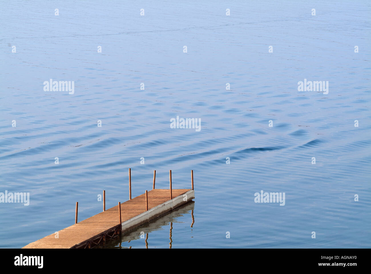 Fishing dock in a lake Stock Photo - Alamy