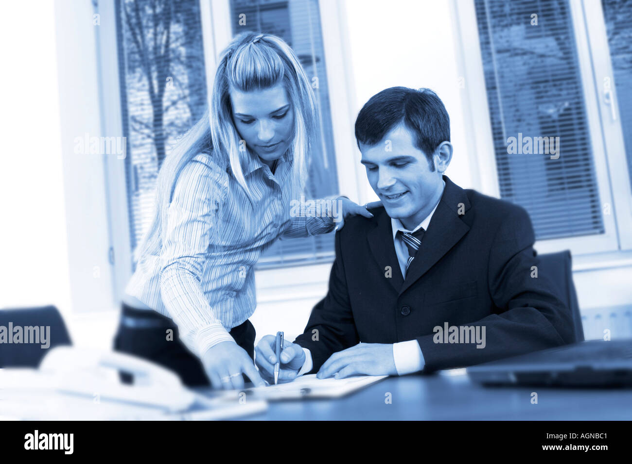 Two employees in office Stock Photo - Alamy