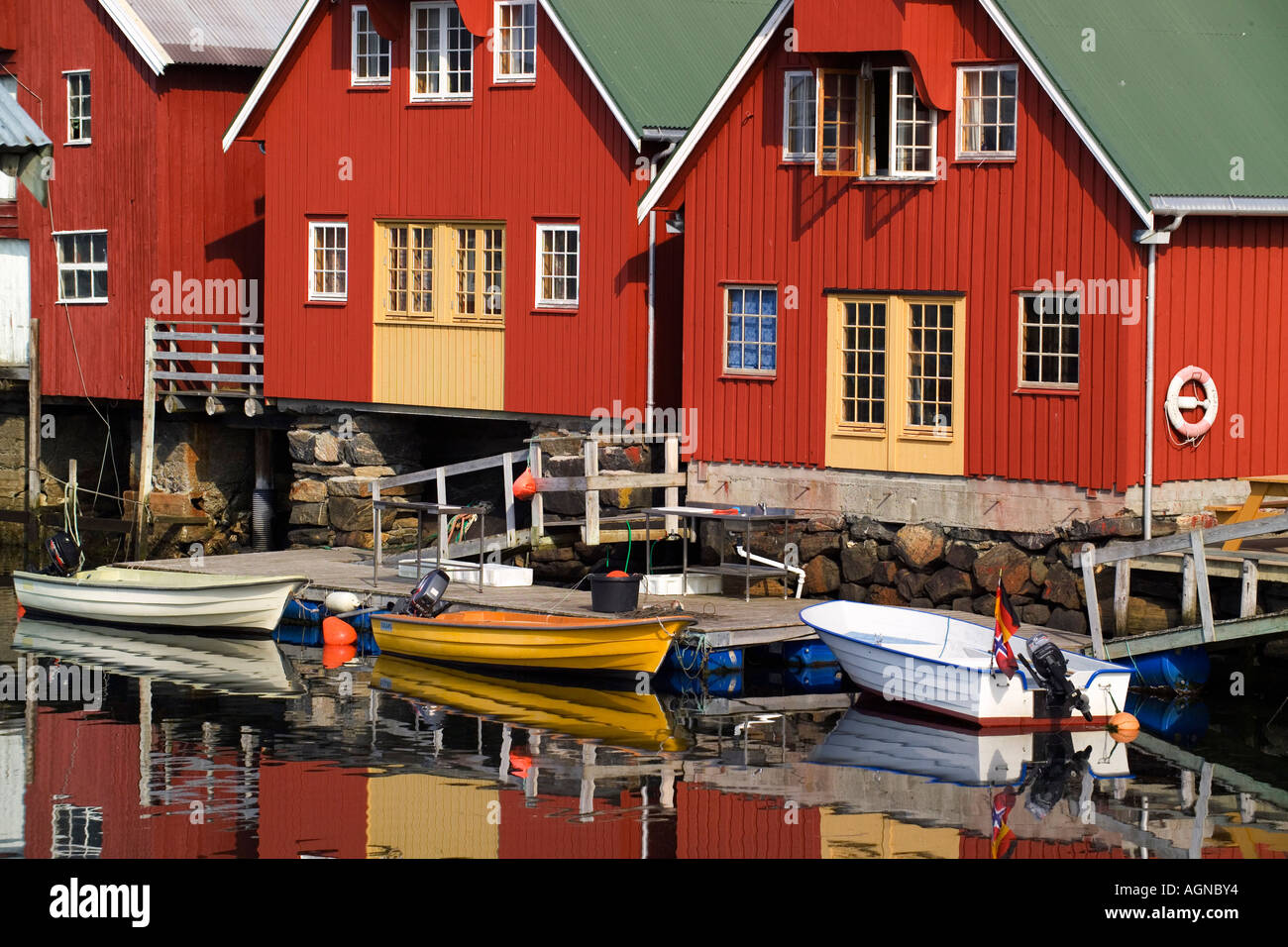 Boats docked in front of traditional boathouses Bud More and Romsdal ...