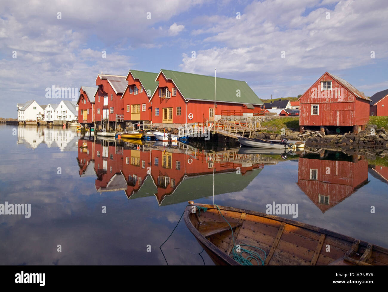 Old rowboat in front of traditional boathouses Bud More and Romsdal ...