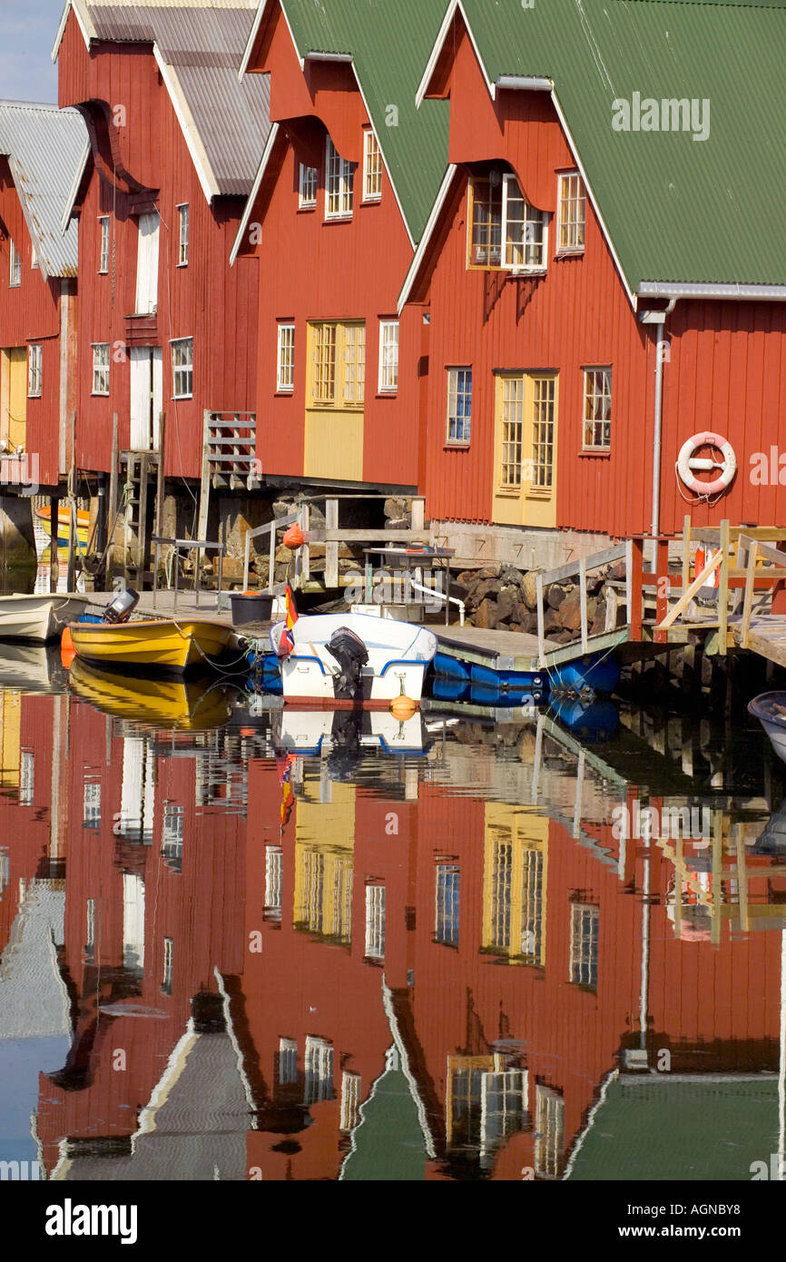 Old rowboat in front of traditional boathouses Bud More and Romsdal ...