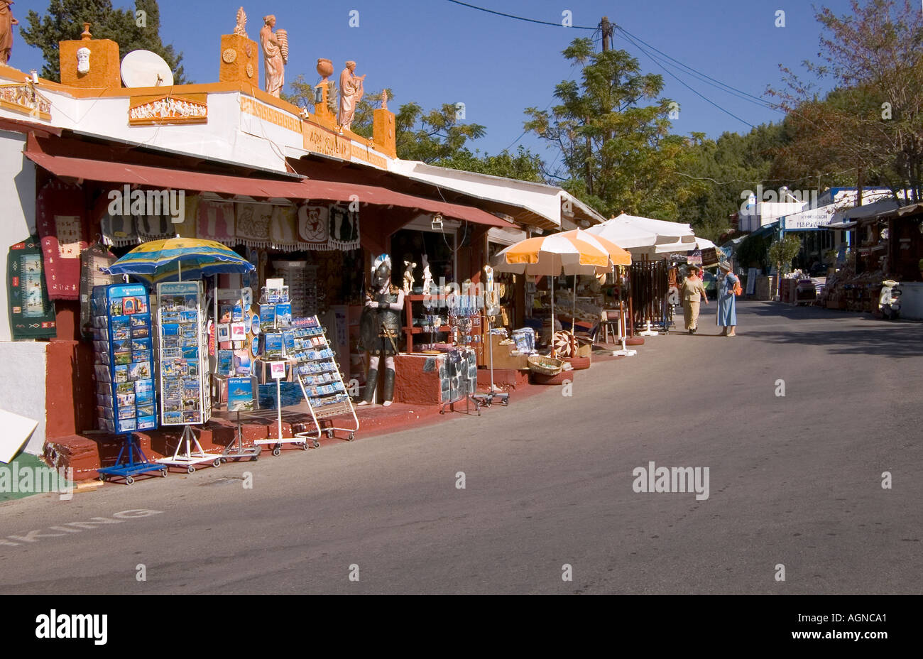 dh Zia ASFENDIOU GREECE KOS Women tourists couple walking by souvenir ...