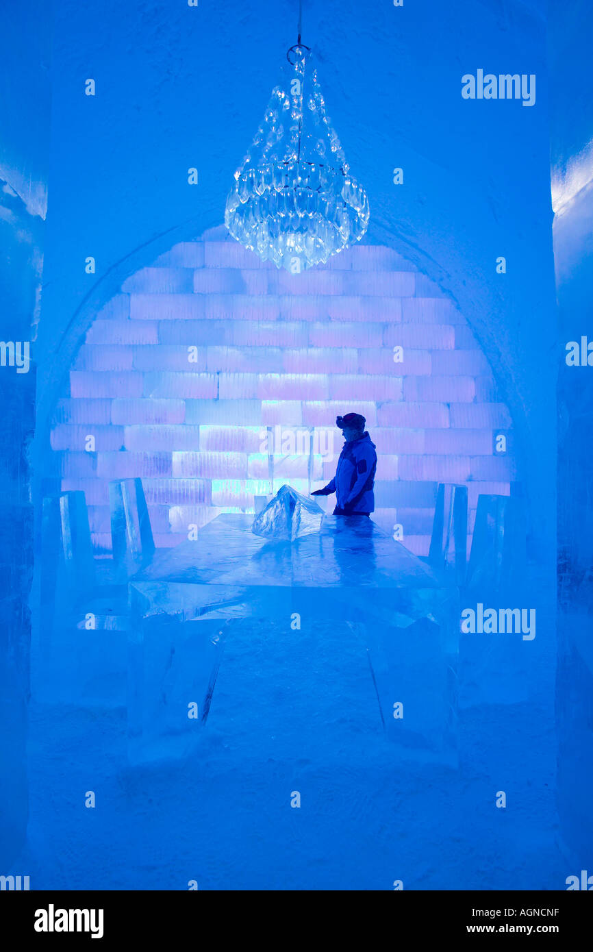 A person at a dinner table ice sculpture inside the Ice hotel ...
