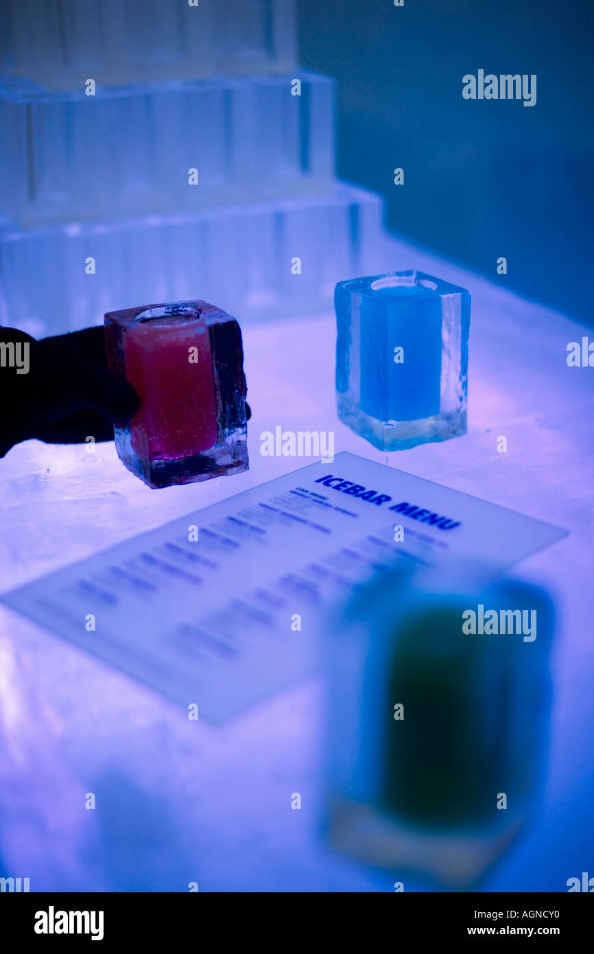 Drink in glass made of ice next to bar list at the Absolute Icebar of ...