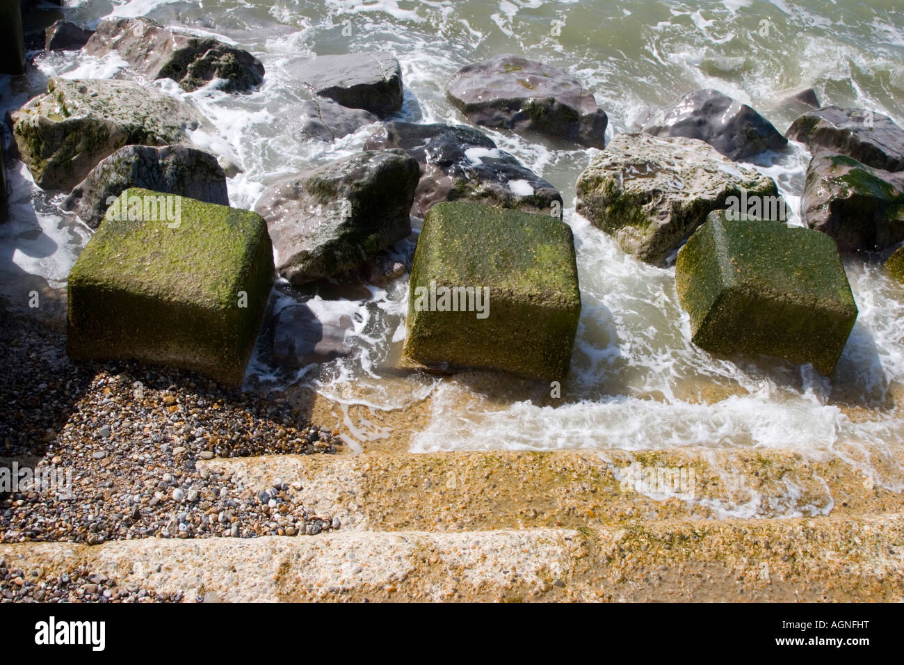Blocks of concrete used as sea defences Stock Photo - Alamy