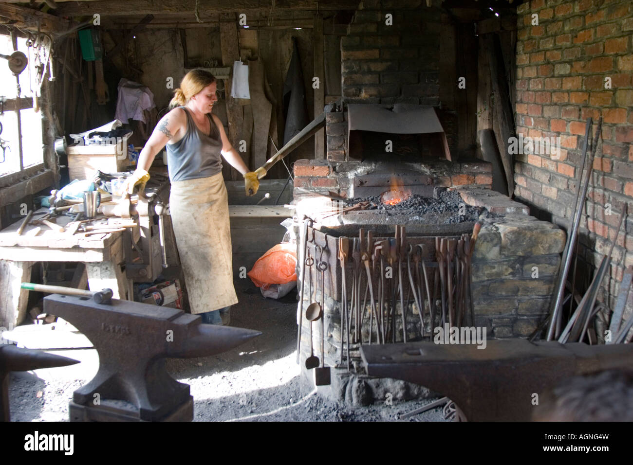 Female Blacksmith Working Forge Stock Photos & Female Blacksmith ...