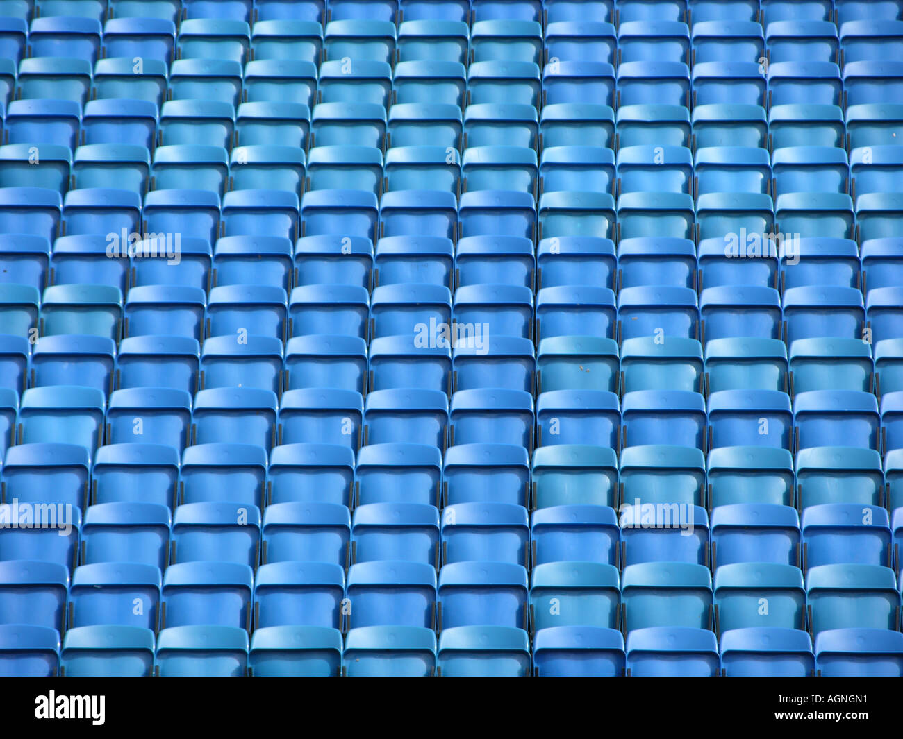 Blue seat rows on a spectator's stand Stock Photo - Alamy