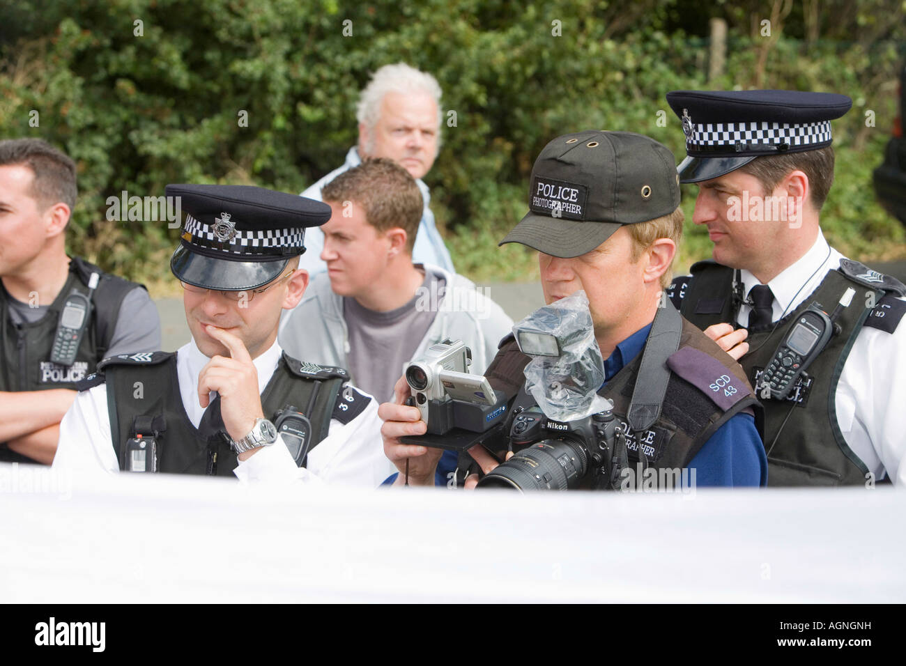 police photographer, photographing the protestors at the climate camp ...