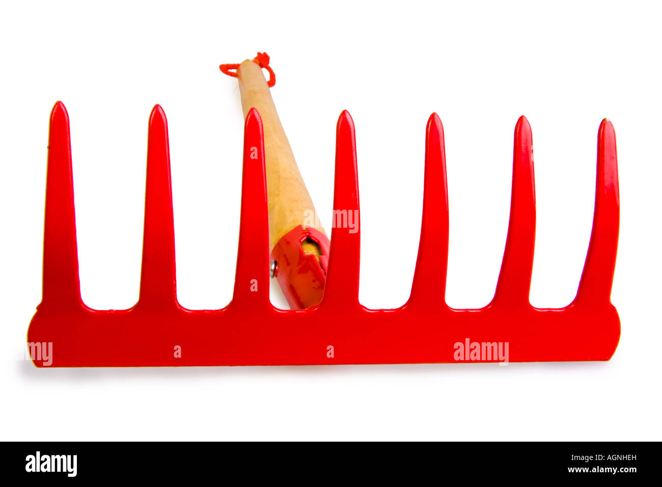 Red garden rake Stock Photo - Alamy