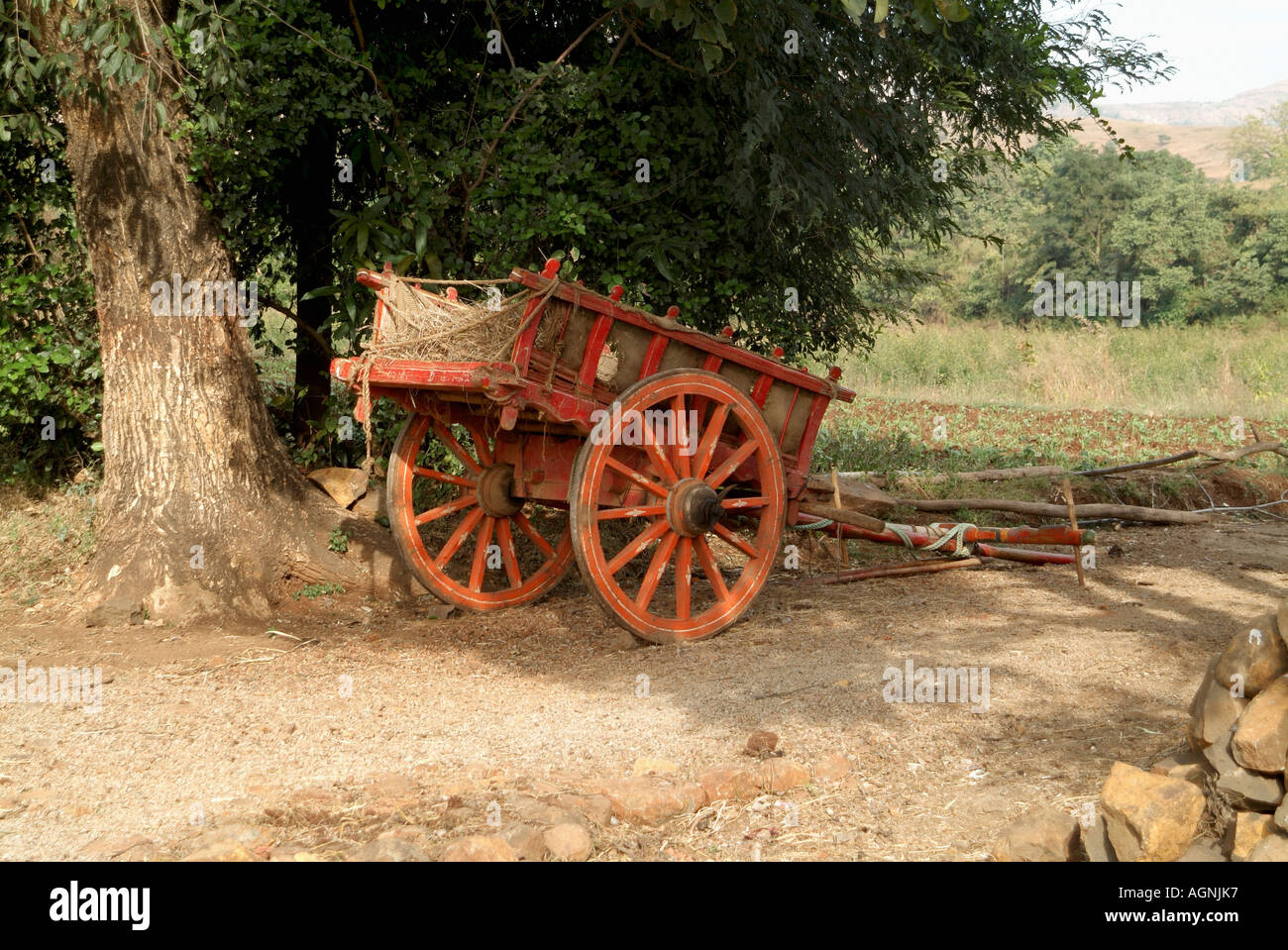 Primitive wooden wheel cart hi-res stock photography and images - Alamy