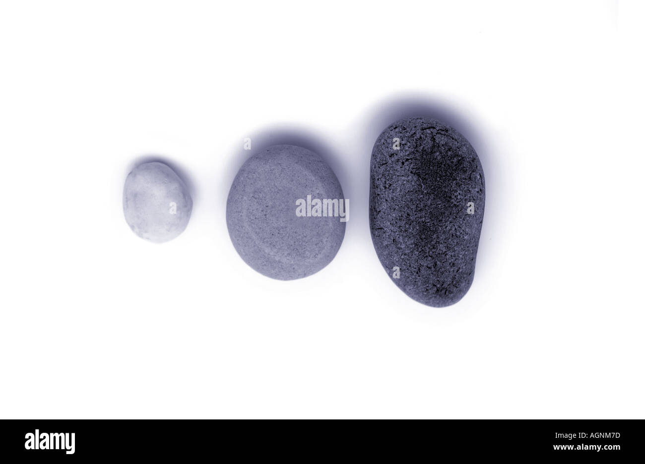 Stones of different sizes on a white background Stock Photo - Alamy