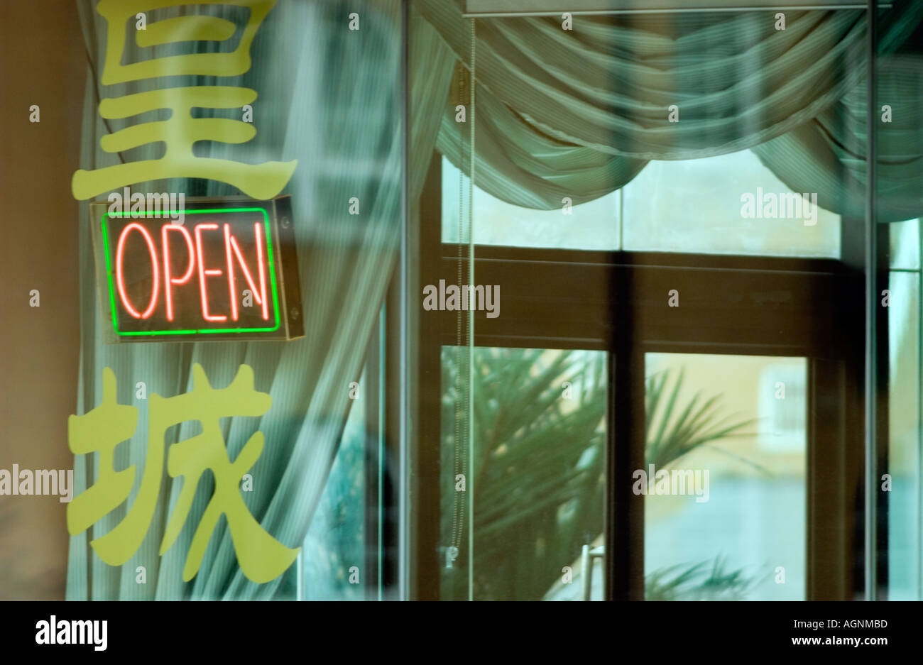 Open sign in a Chinese restaurant window Stock Photo - Alamy