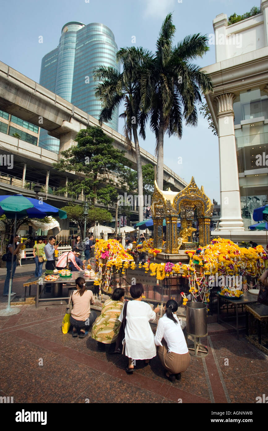 People crouching and praying at Erawan Shrine Ratchadamri Road near ...