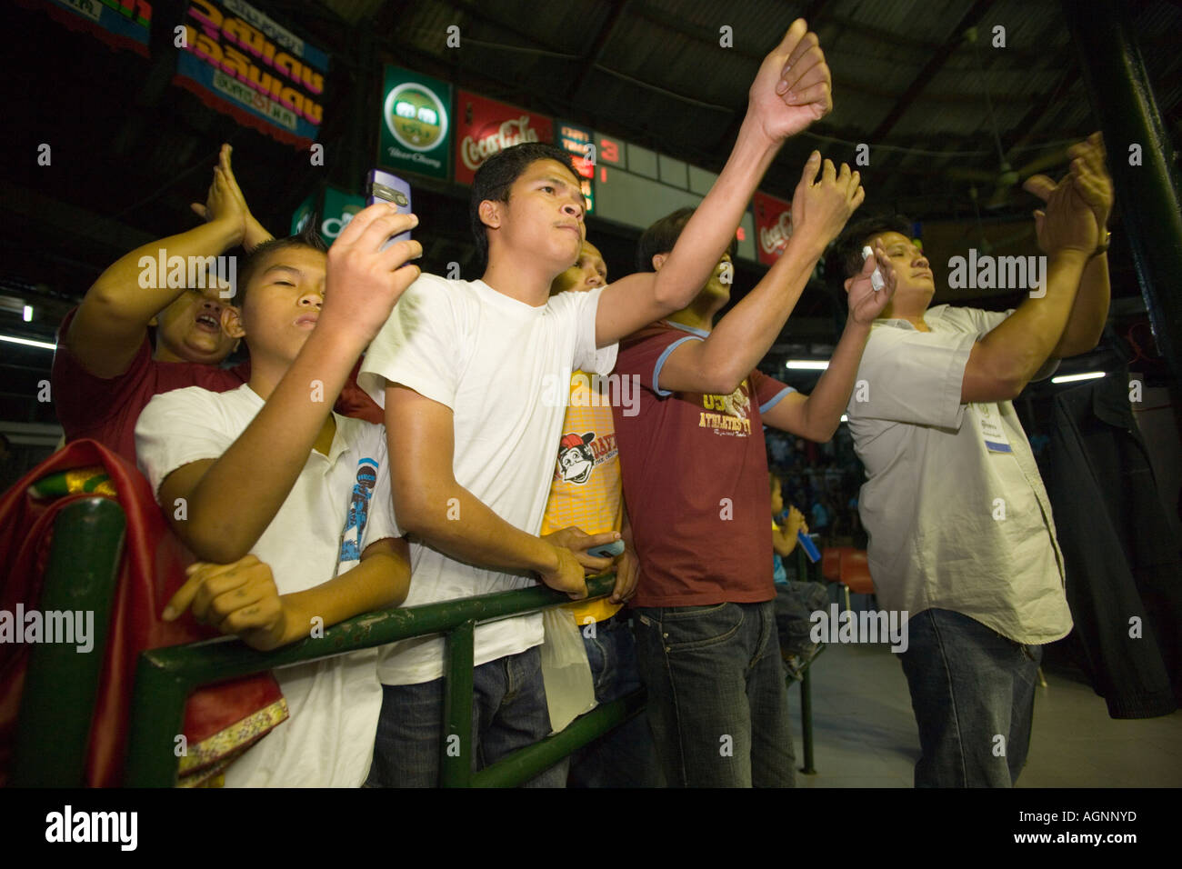Spectators applauding during a Thai boxing competition Lumphini Stadium ...
