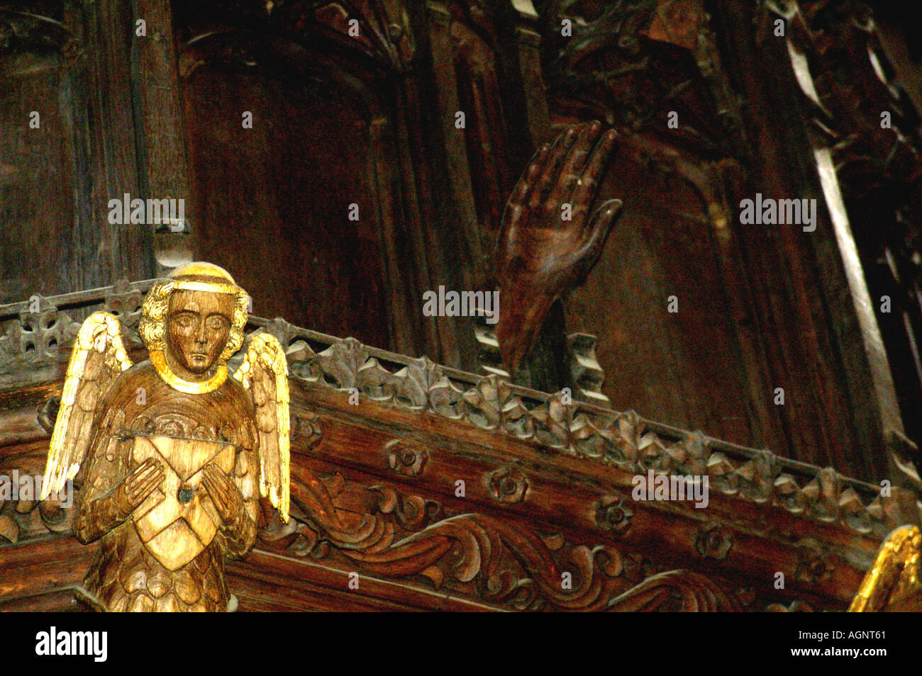 Wooden carved hand and angel in cathedral church of St Peter and St ...