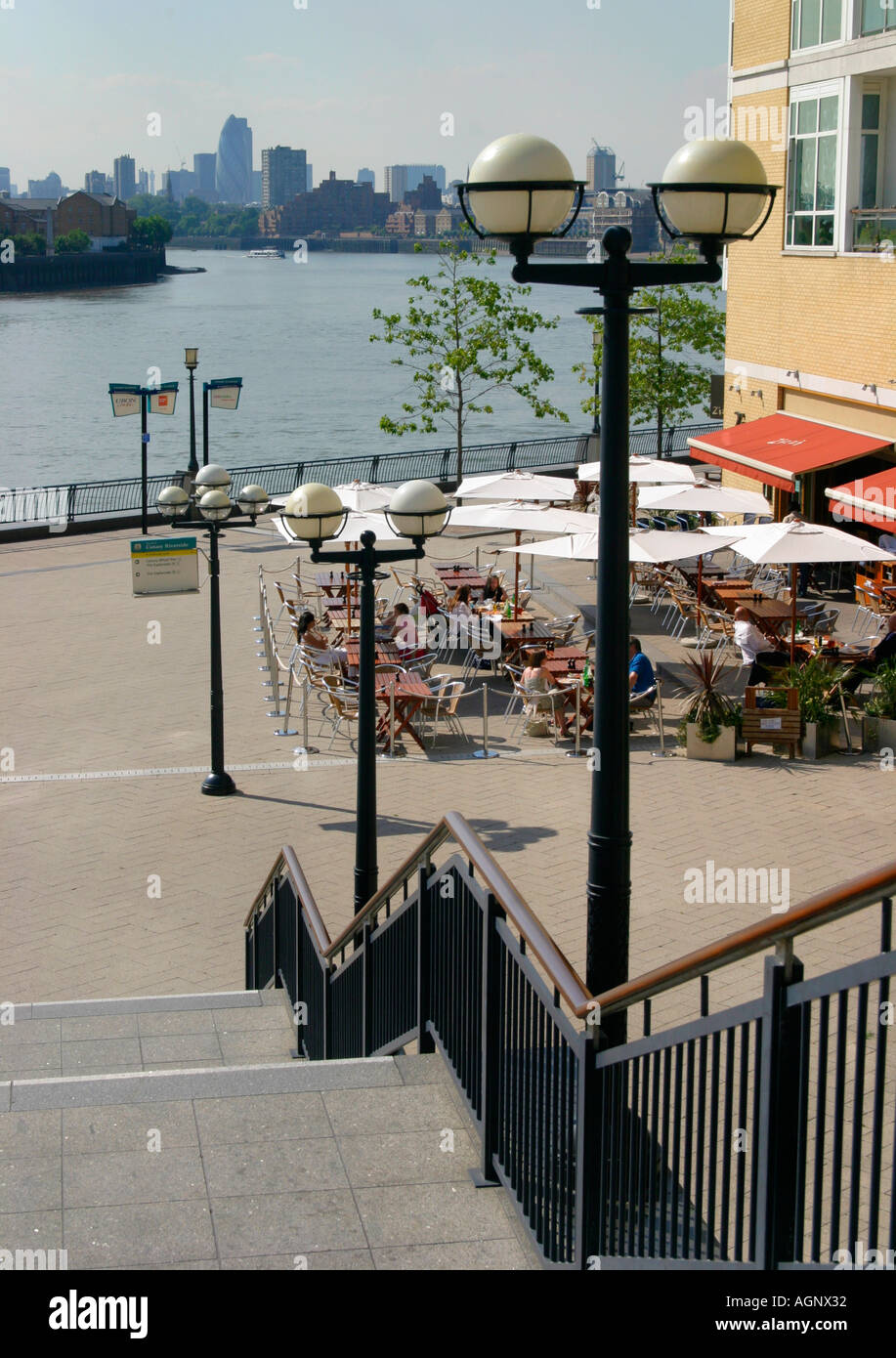 London skyline and riverside restaurants viewed from Westferry Circus ...