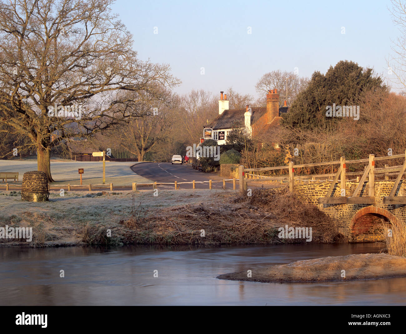 RIVER WEY flowing through the village in winter Tilford Surrey England ...