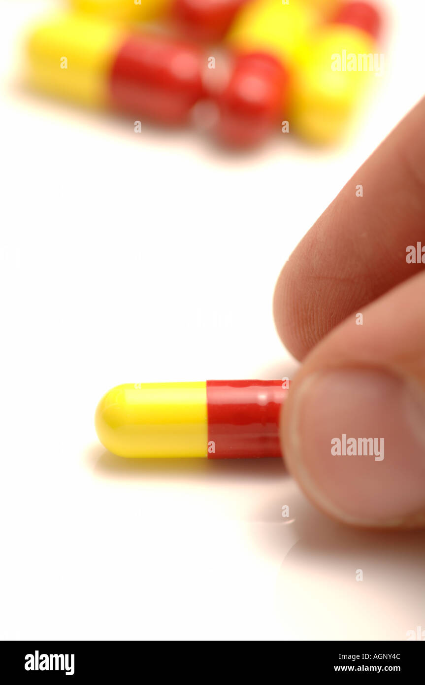male hand holding capsule Stock Photo - Alamy