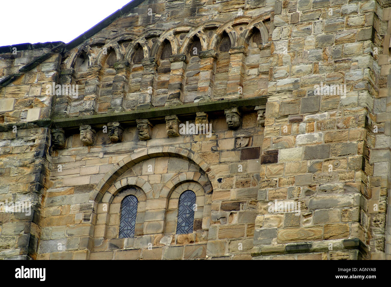 Carved faces on the wall of Durham cathedral England United Kingdom UK ...