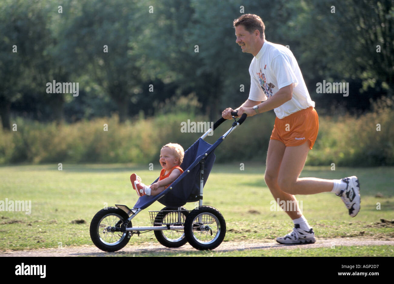 Father and child jogging Stock Photo - Alamy