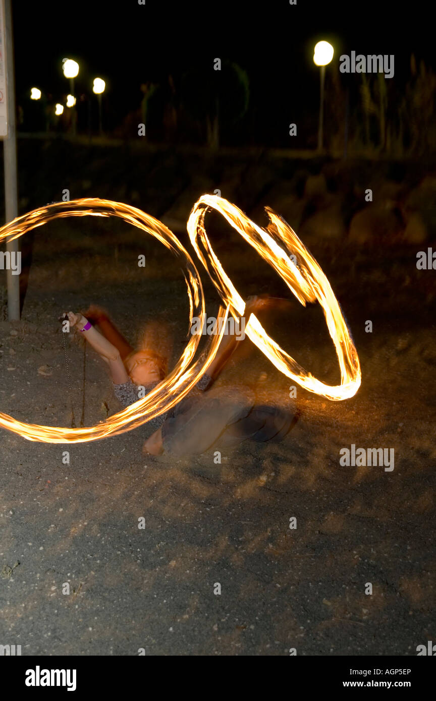 juggling with fire pois night shot Stock Photo - Alamy