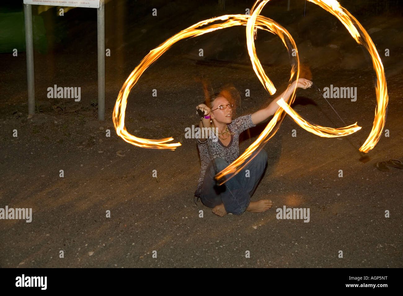 juggling with fire pois night shot Stock Photo - Alamy