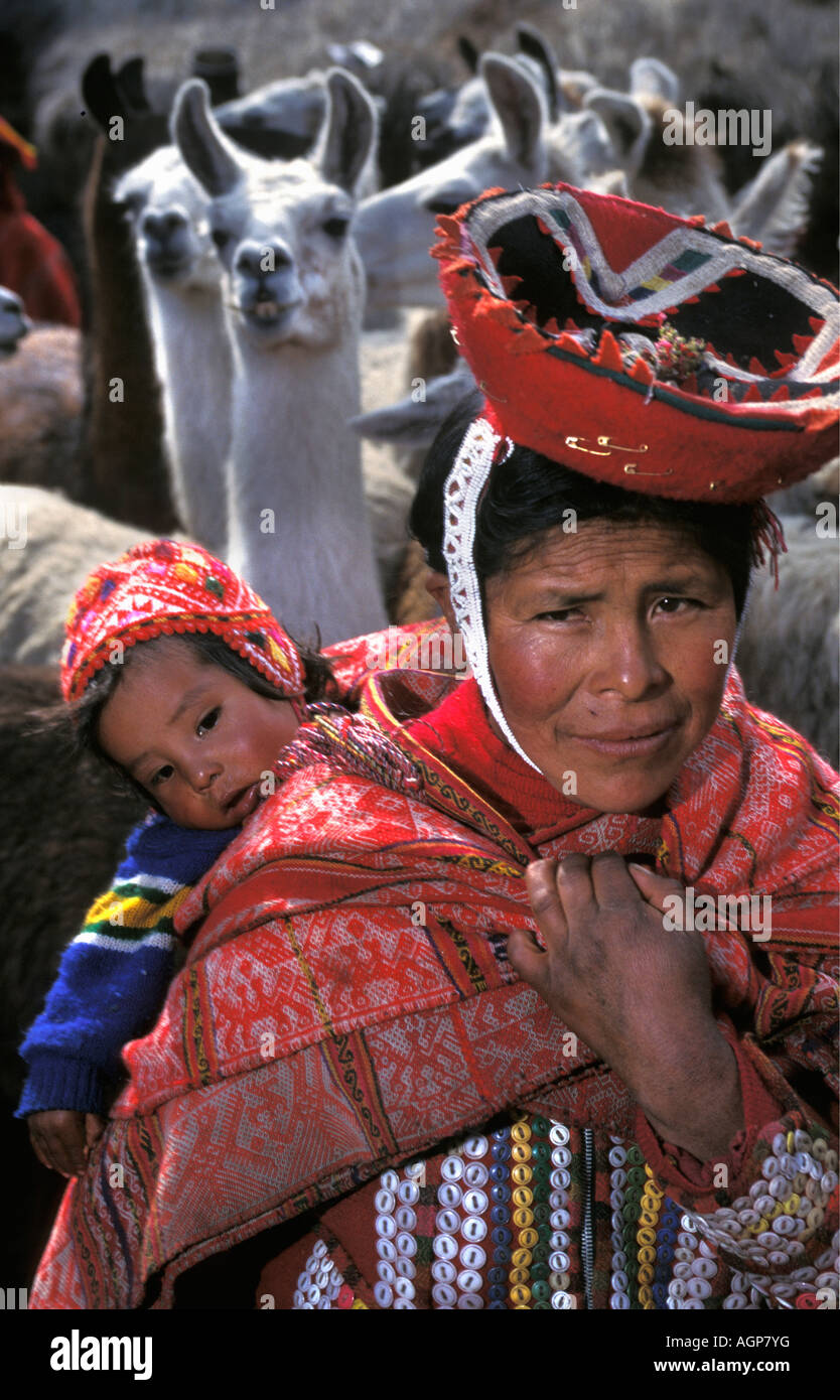 Peru Huilloc, Ollantaytambo, Indian woman with child with llamas in ...