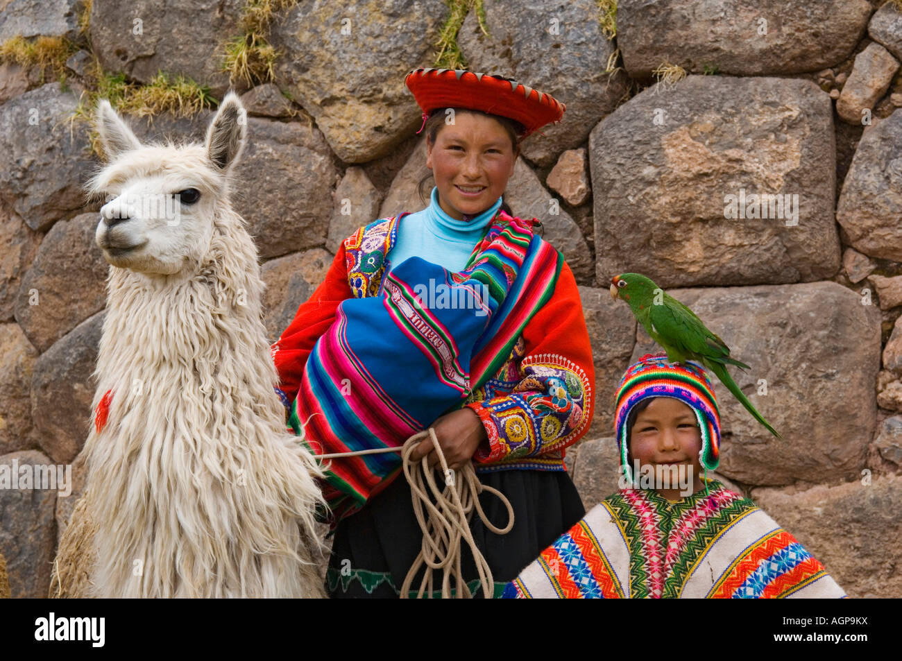 Peru, Cusco, Sacsayhuaman Inca ruins, Portrait of woman with llama and ...