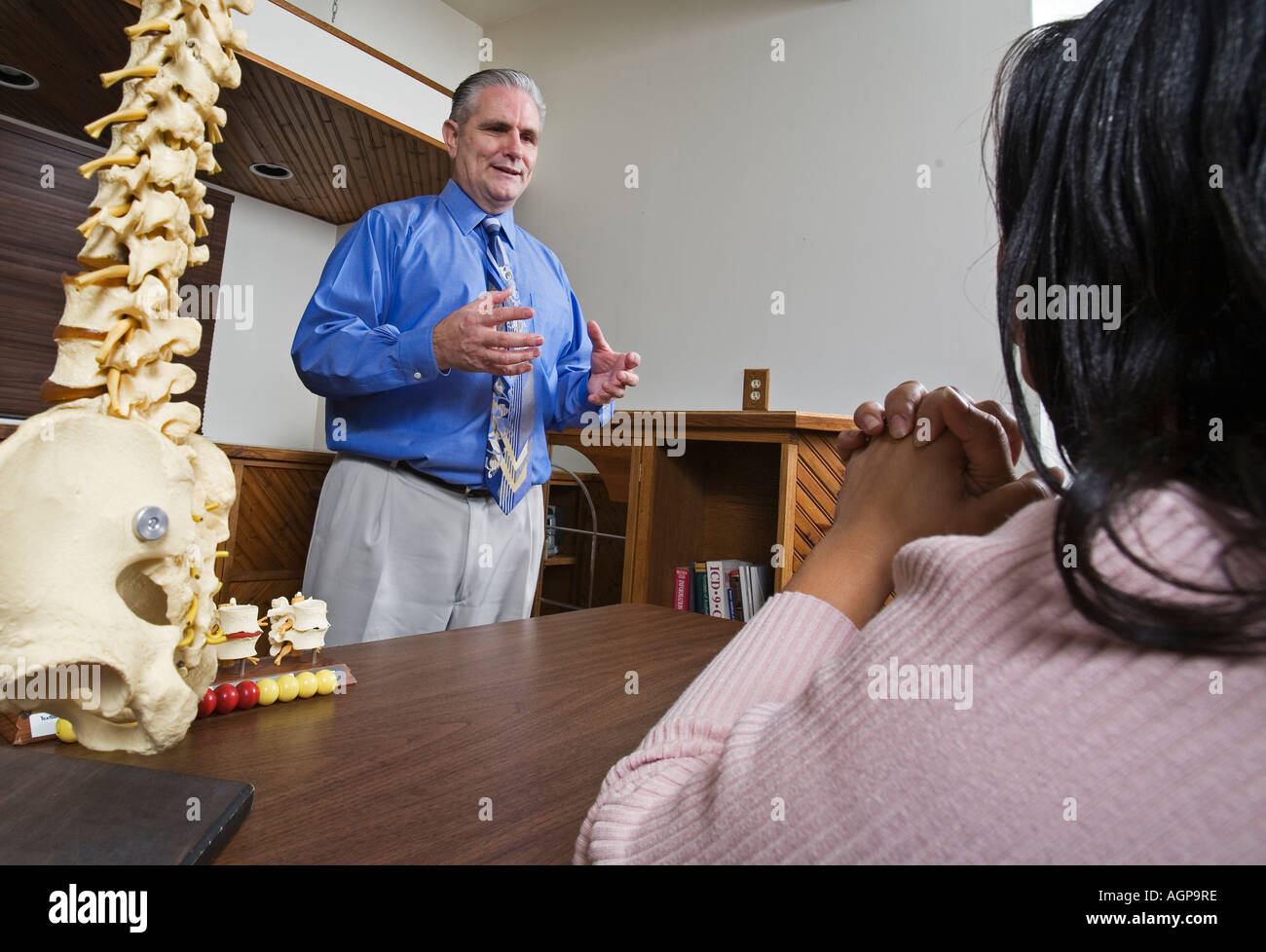 Chiropractor talking patient hi-res stock photography and images - Alamy