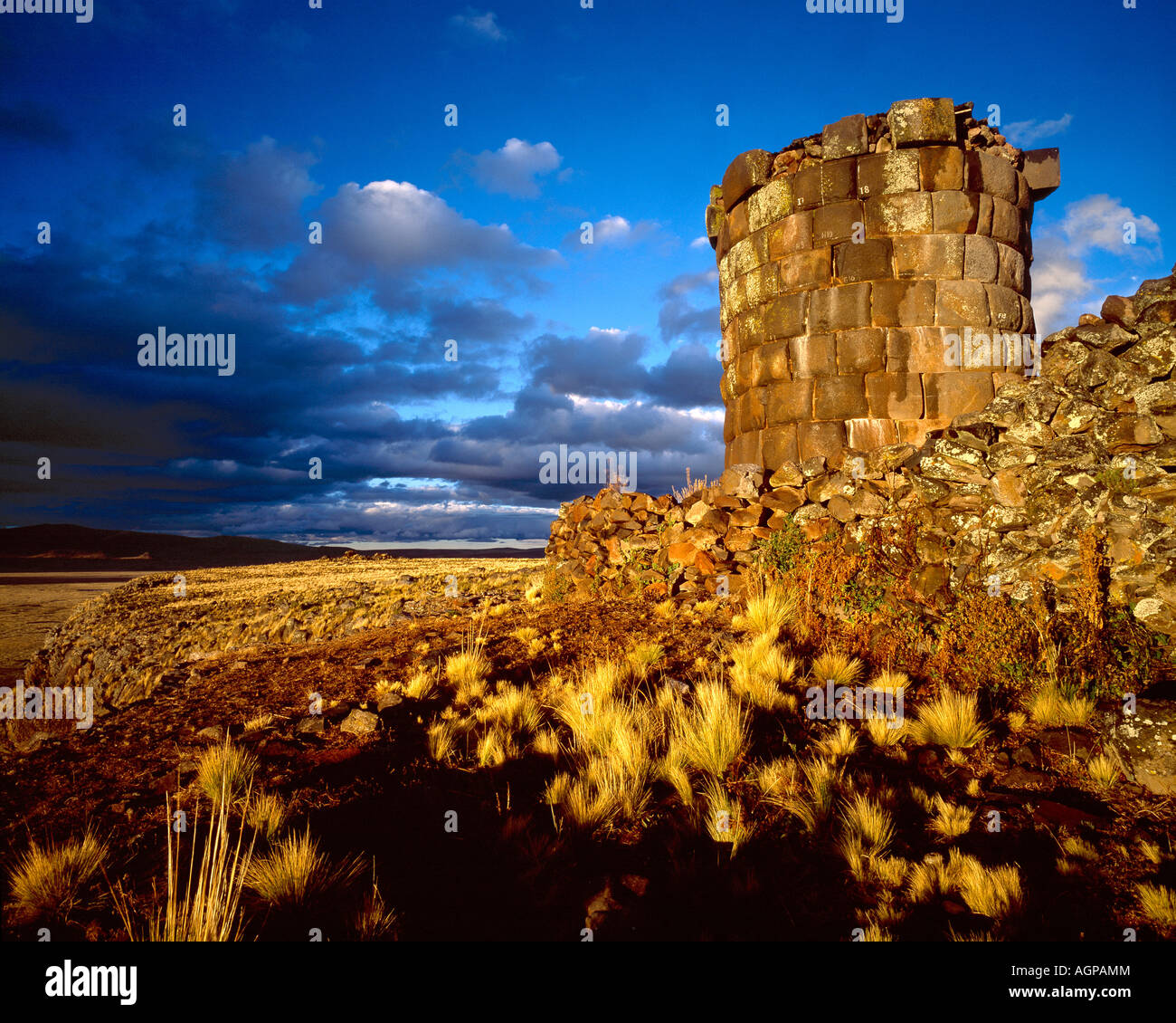 South America, Peru, near Lake Titicaca. Ancient Inca tomb at sunset ...