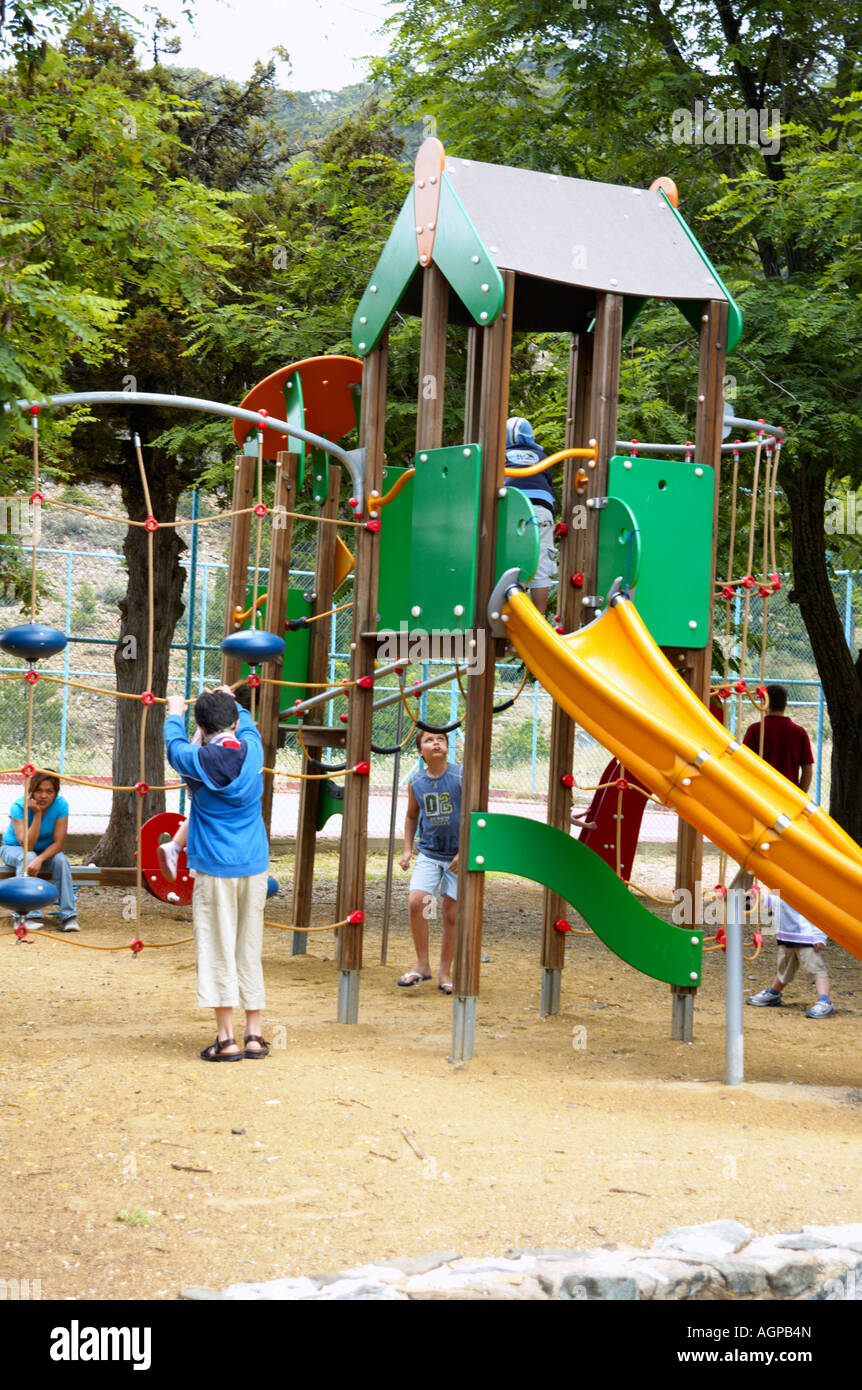 Children playing in a playground Stock Photo - Alamy