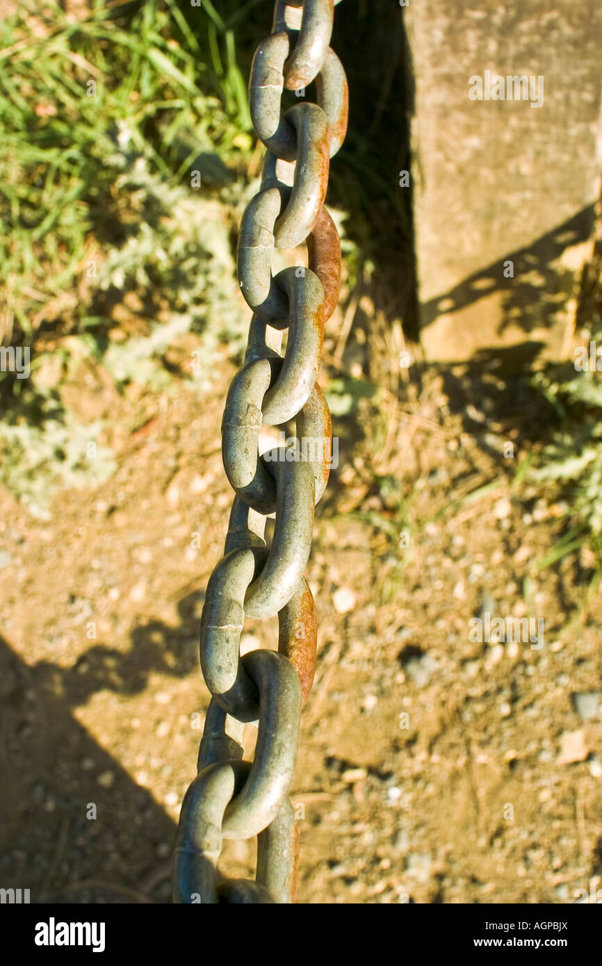 metal rusting chain across path in countryside Stock Photo - Alamy
