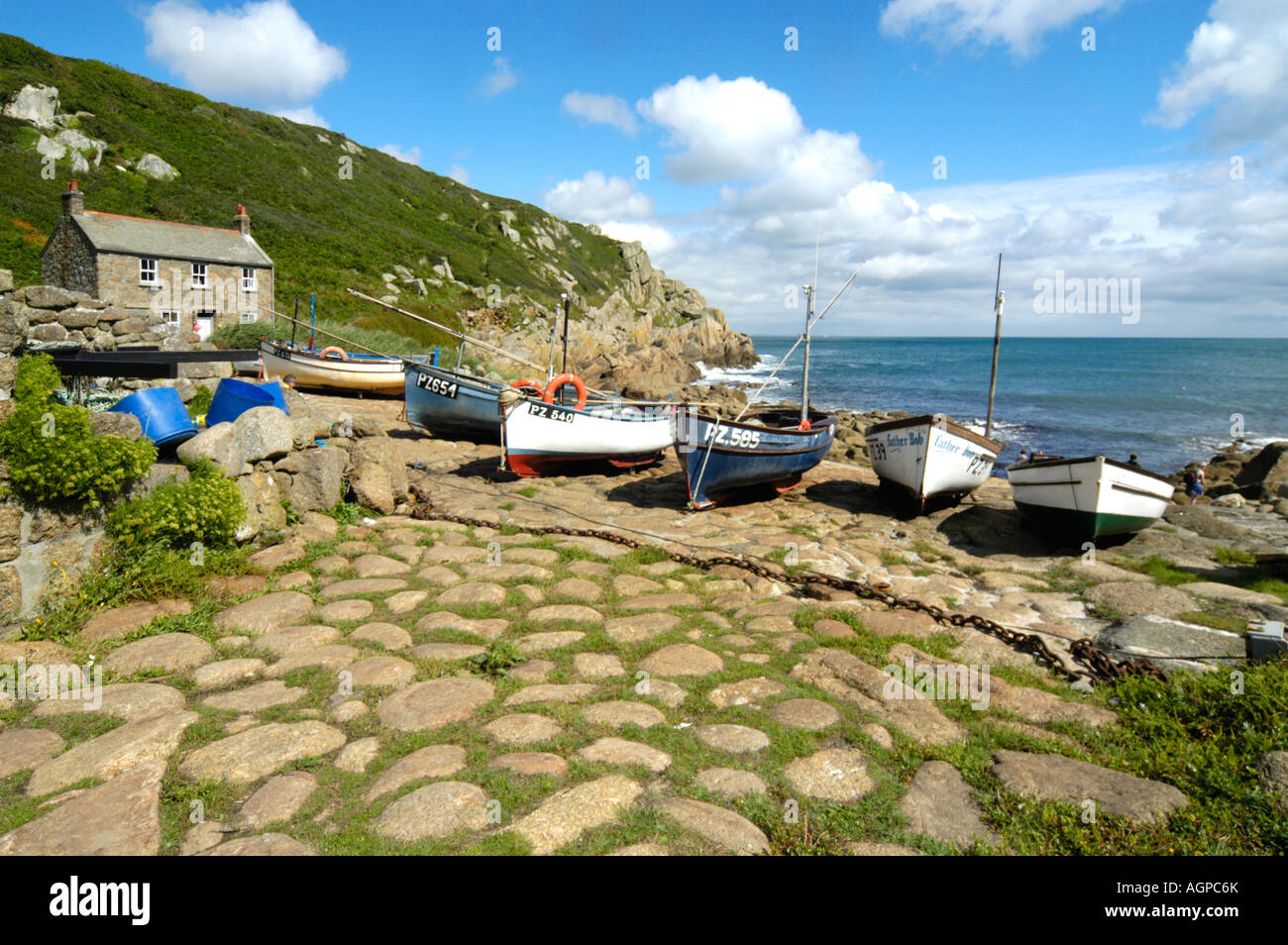 Cottage and boats at the harbour Penberth Cornwall England Stock Photo ...
