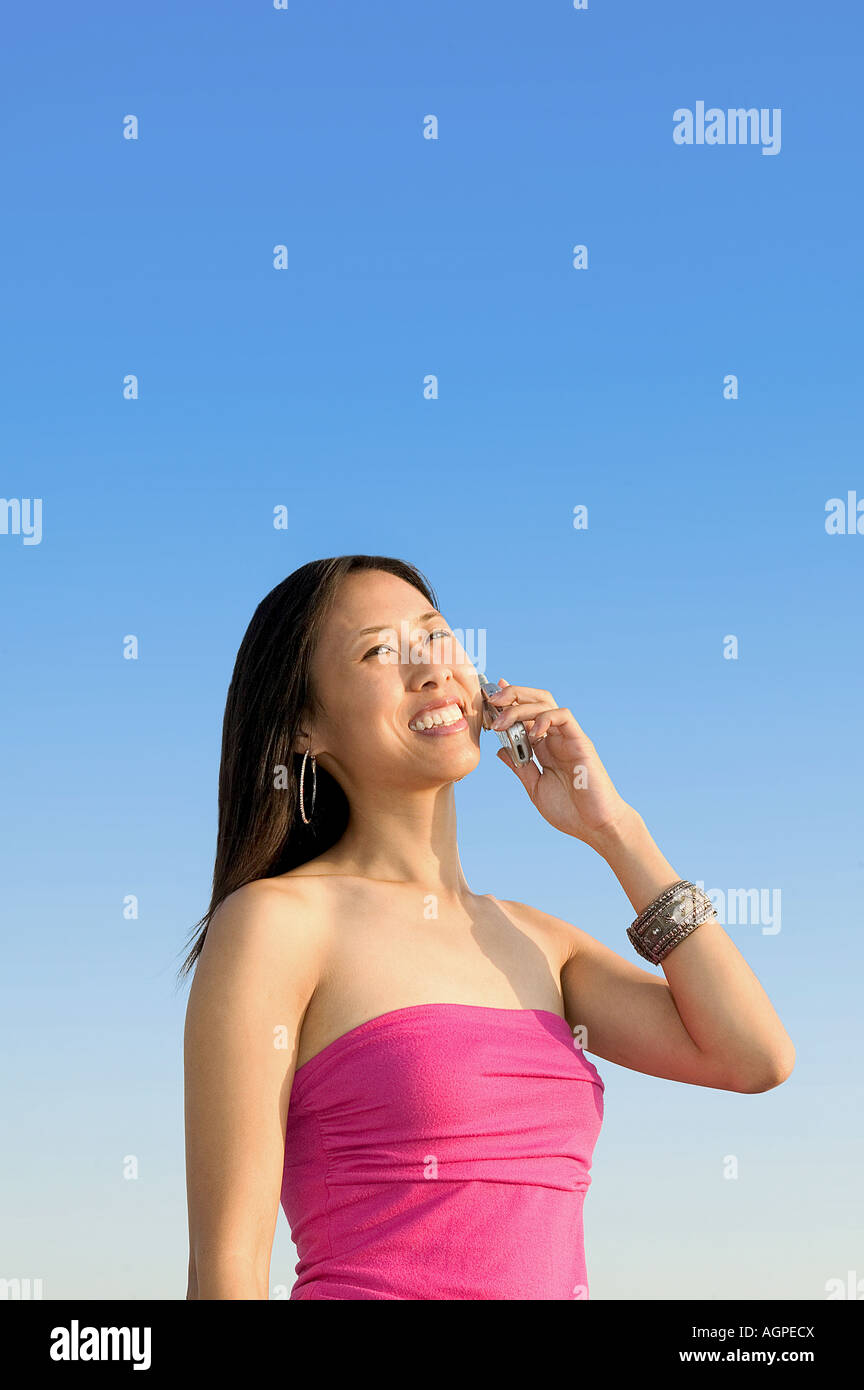 Woman in Pink Talking on Cell Phone Stock Photo - Alamy