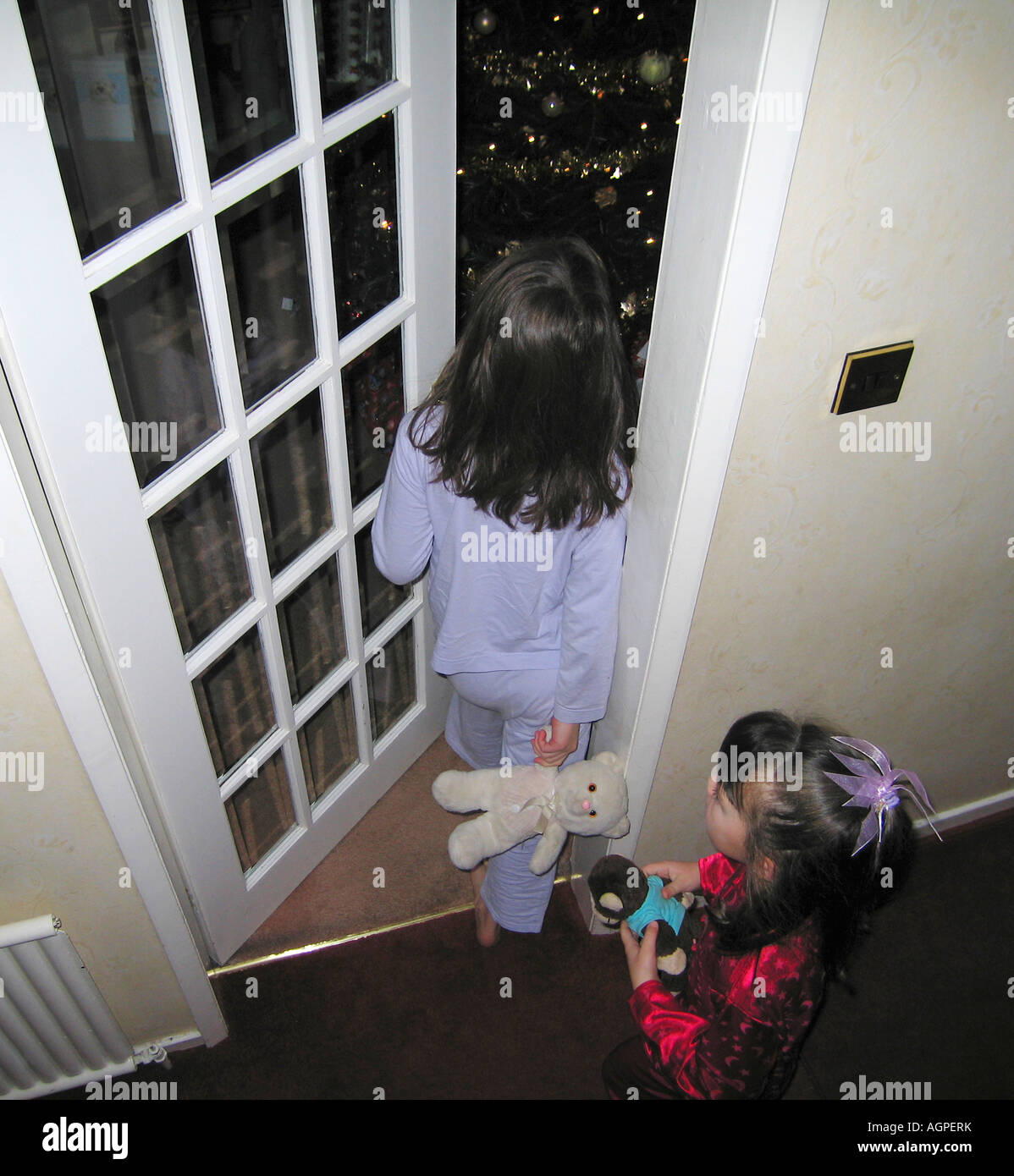Children entering living room on Christmas morning Stock Photo - Alamy