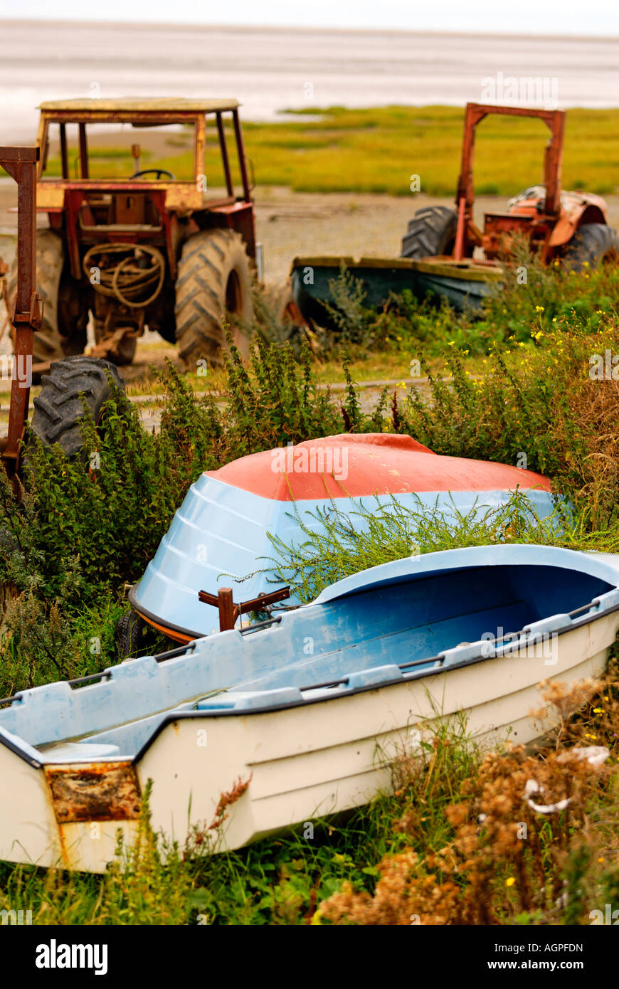 Shrimpers' tractors and boats on the beach at Lytham St. Annes in ...