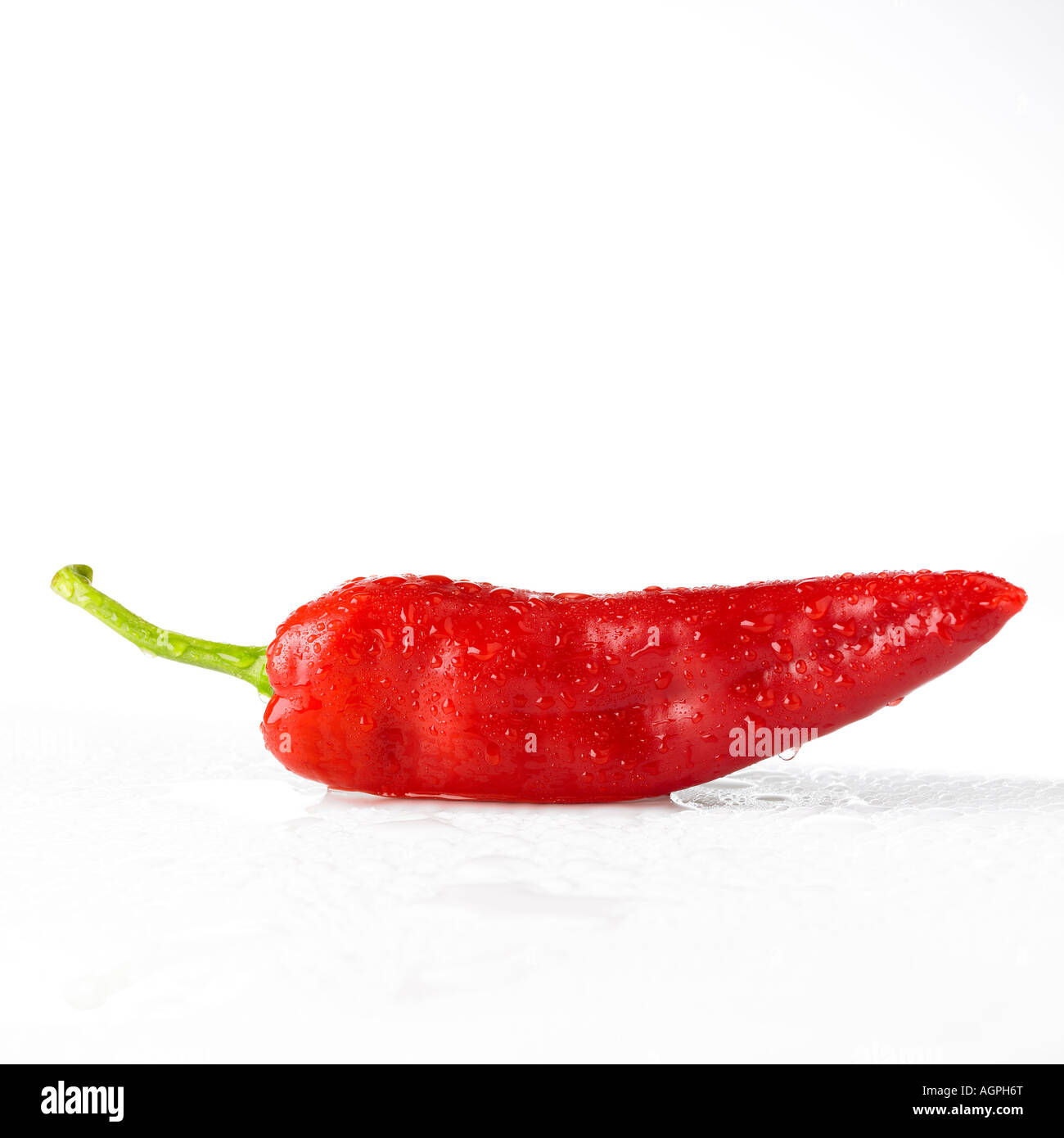 A fresh sweet pointed pepper covered in water droplets Stock Photo - Alamy