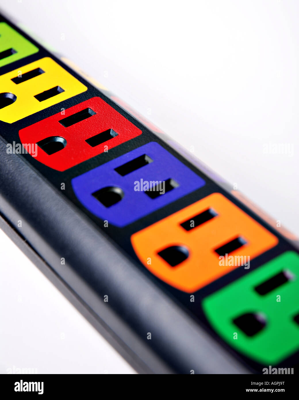 closeup of surge supressor with multi colored outlets on white Stock ...