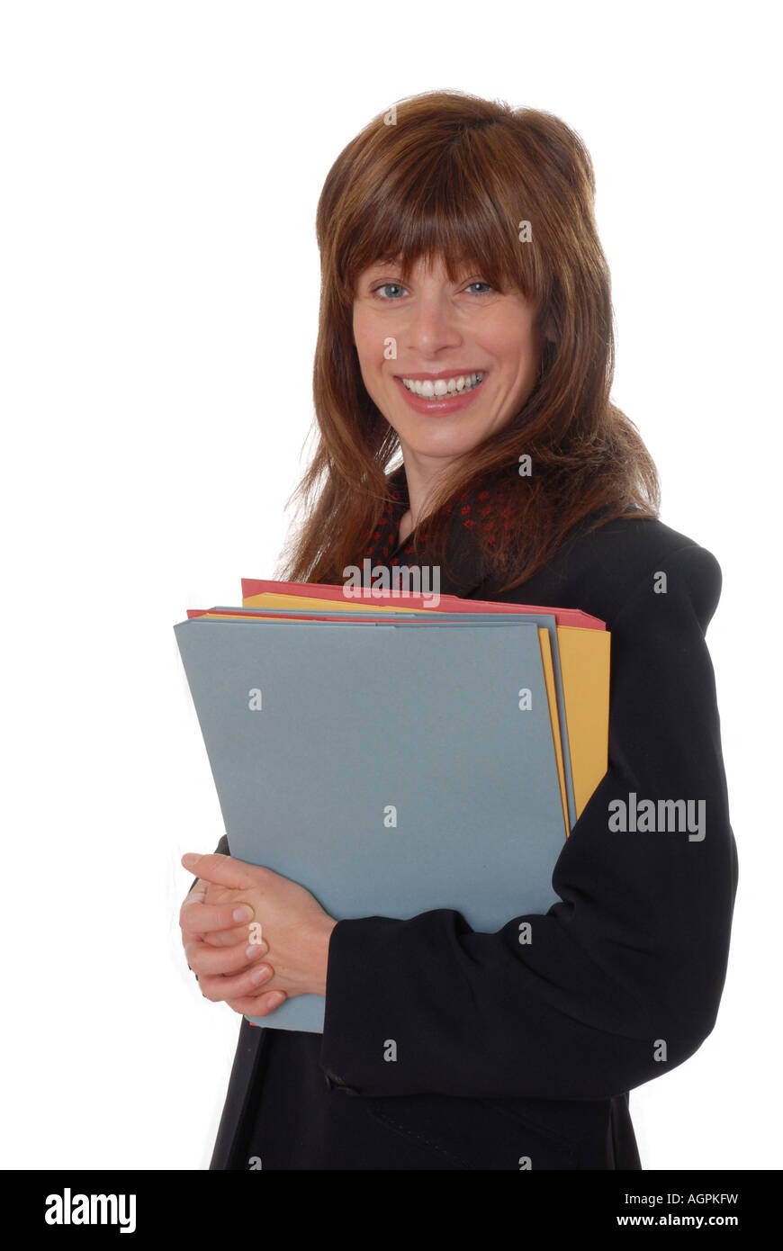attractive smiling young female business executive carrying file ...