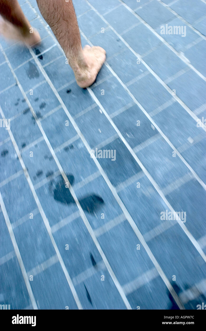 A view of a young adult Caucasian male leg and foot with footprint on ...