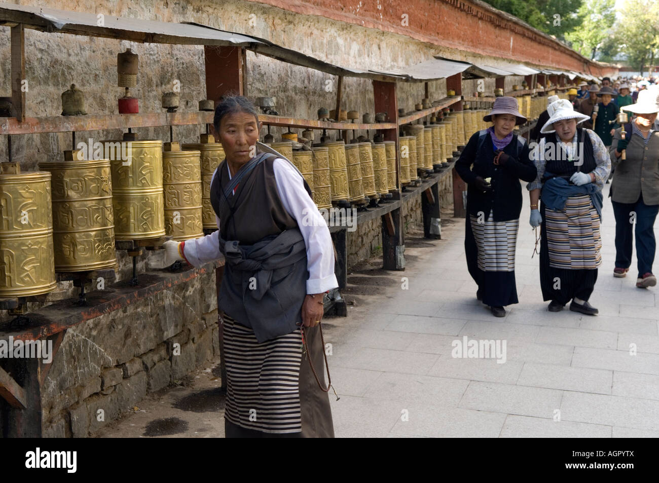 TIBET China Lhasa Buddhist prilgrims circumambulate pray and prostrate ...